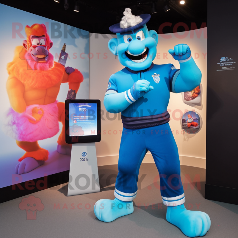 Blue Fire Eater mascot costume character dressed with a Rugby Shirt and ...
