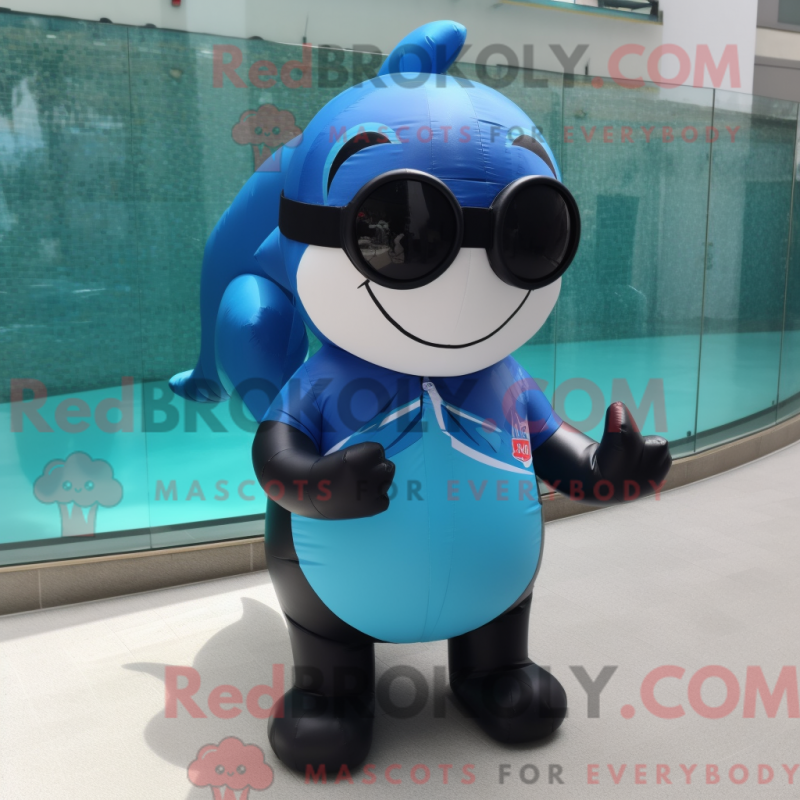 Blue Killer Whale mascot costume character dressed with a Swimwear and ...