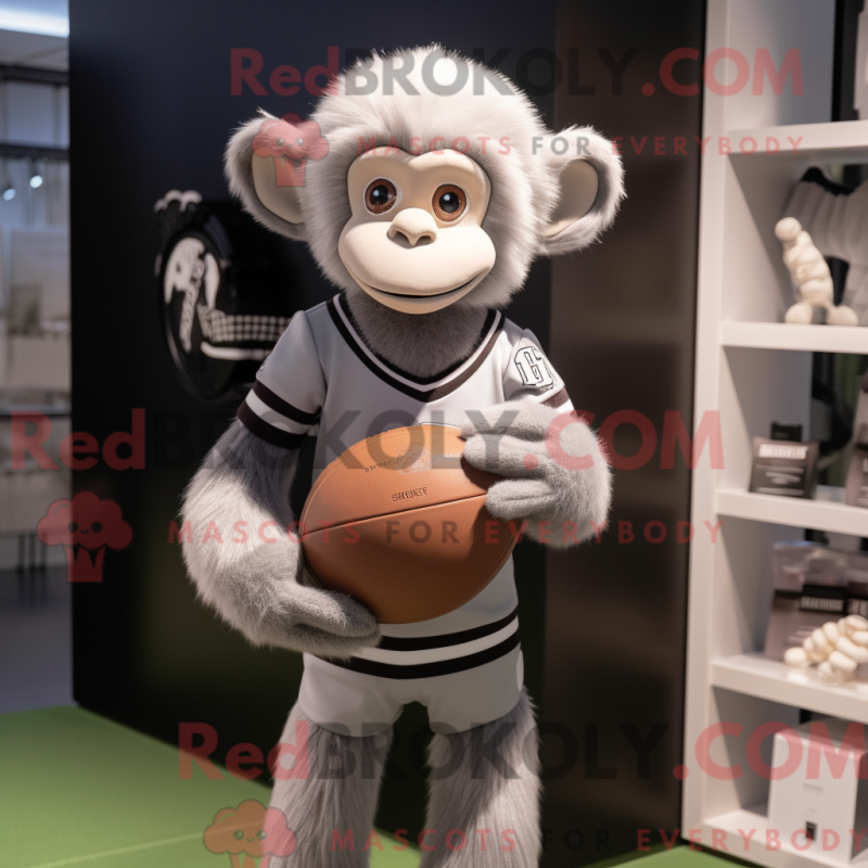 Silver Capuchin Monkey mascot costume character dressed with a Rugby ...