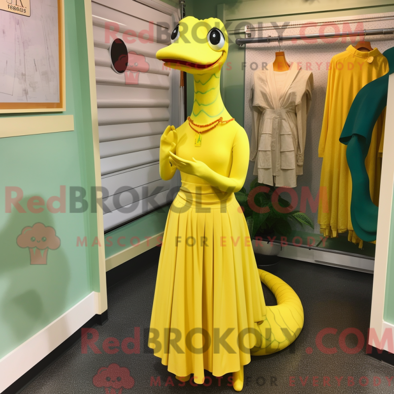 Mascot character of a Lemon Yellow Loch Ness Monster dressed with a ...