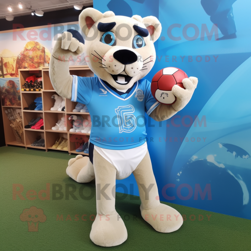 Sky Blue Mountain Lion mascot costume character dressed with a Rugby ...